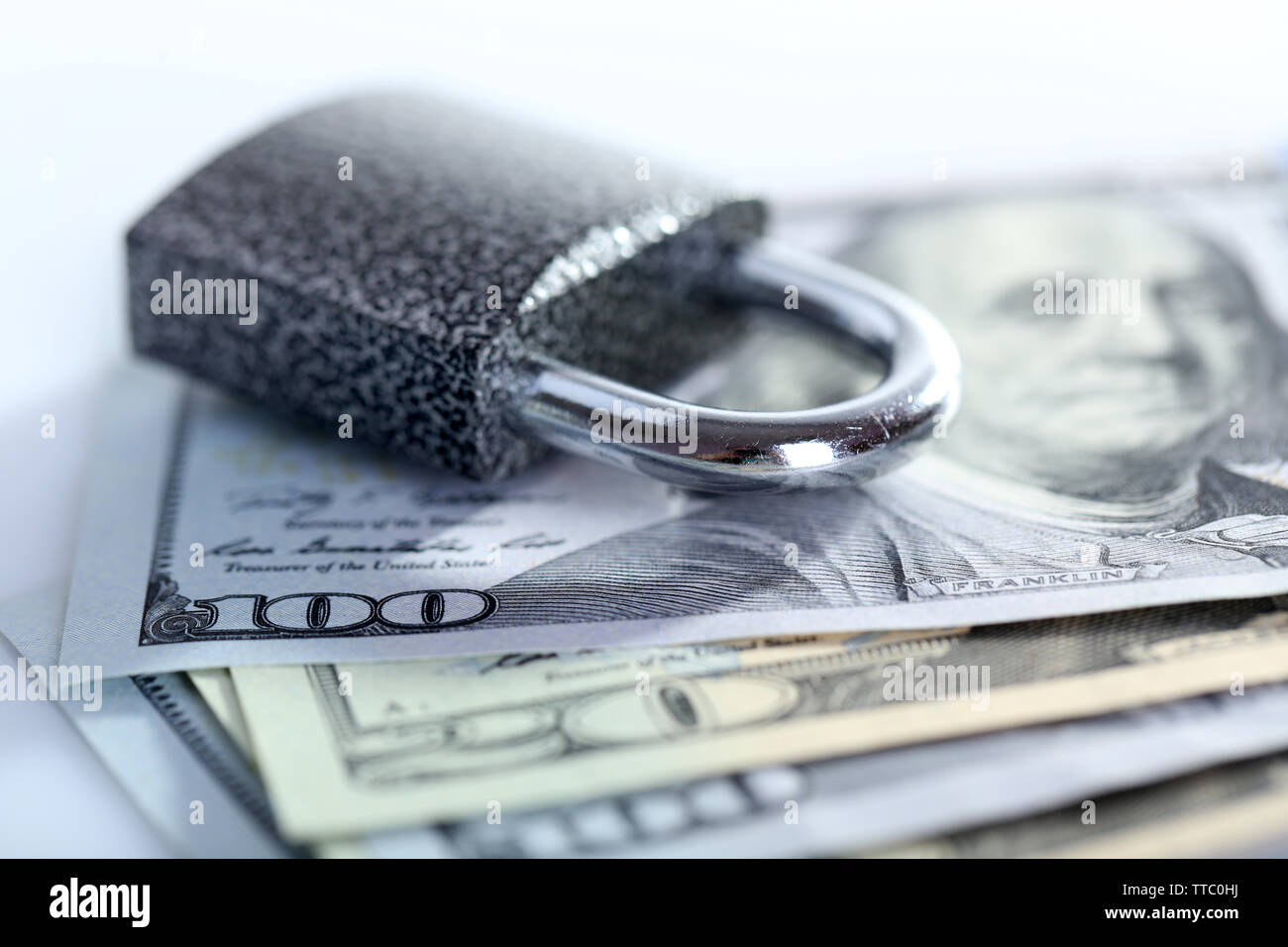 Concept of saving money - lock on dollars background, close up Stock ...