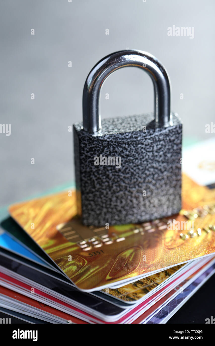 Concept of saving money - lock with credit cards on black background ...