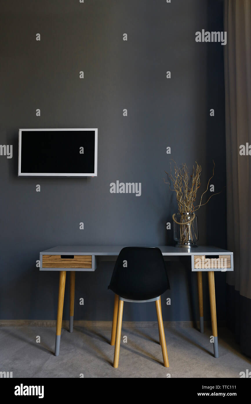 Modern interior - television, chair, table Stock Photo - Alamy