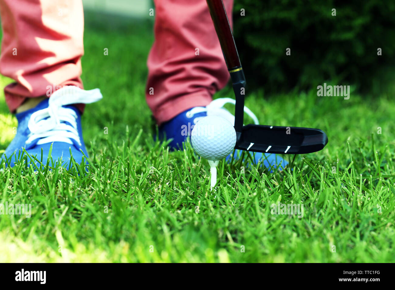 Female golf player at golf course Stock Photo - Alamy