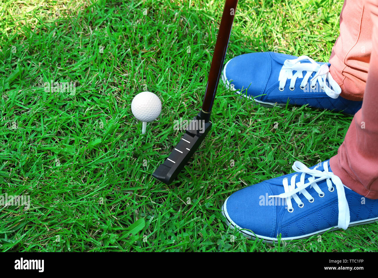 Female golf player at golf course Stock Photo - Alamy