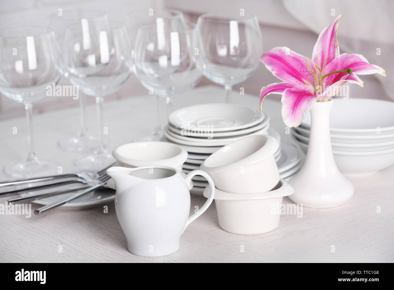 Clean dishes on the table Stock Photo - Alamy