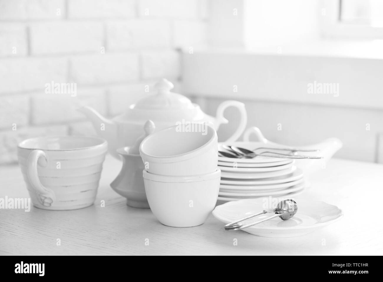 Clean cups on table Black and White Stock Photos & Images - Alamy