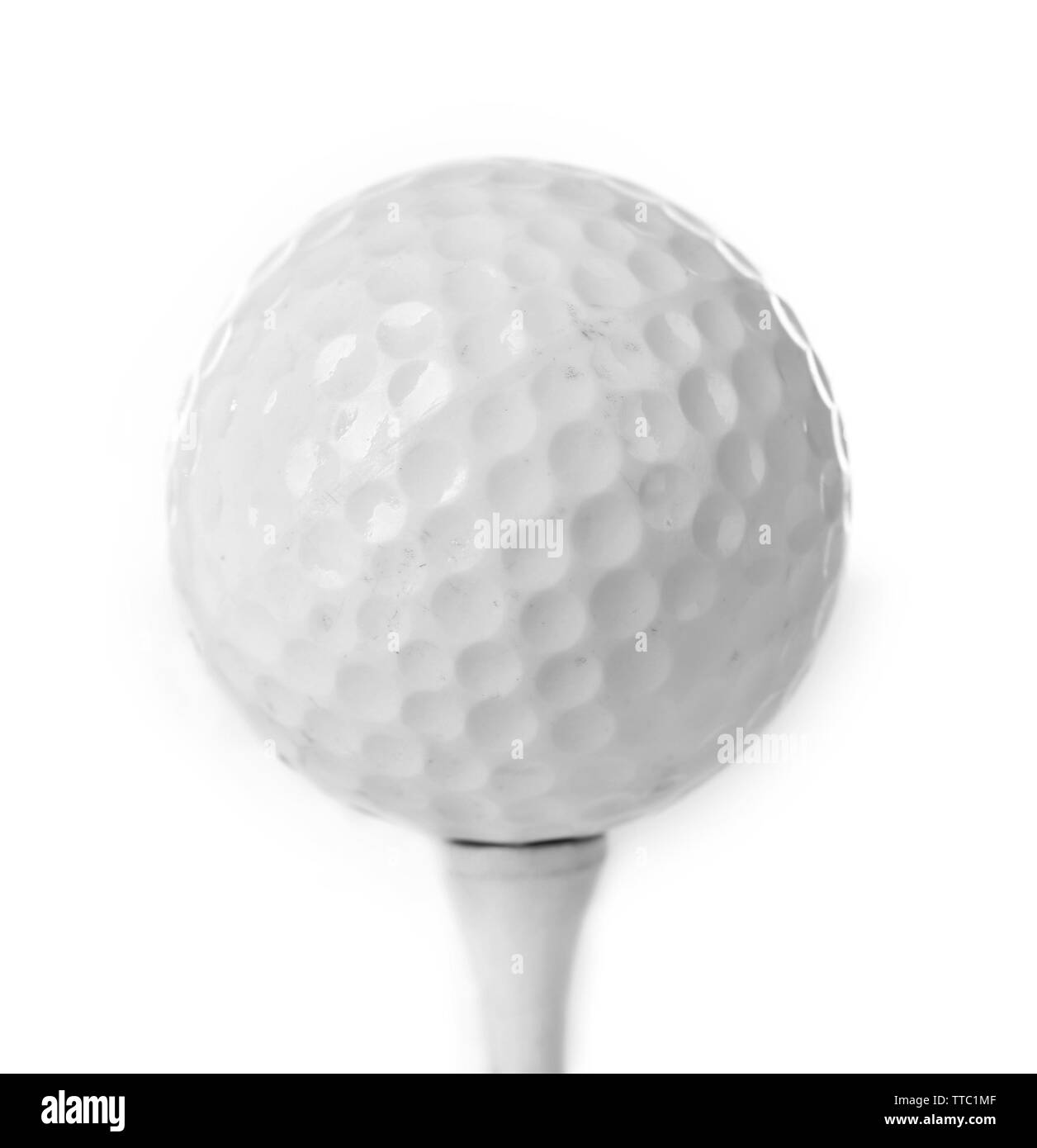 Golf ball on a tee isolated on white background Stock Photo - Alamy