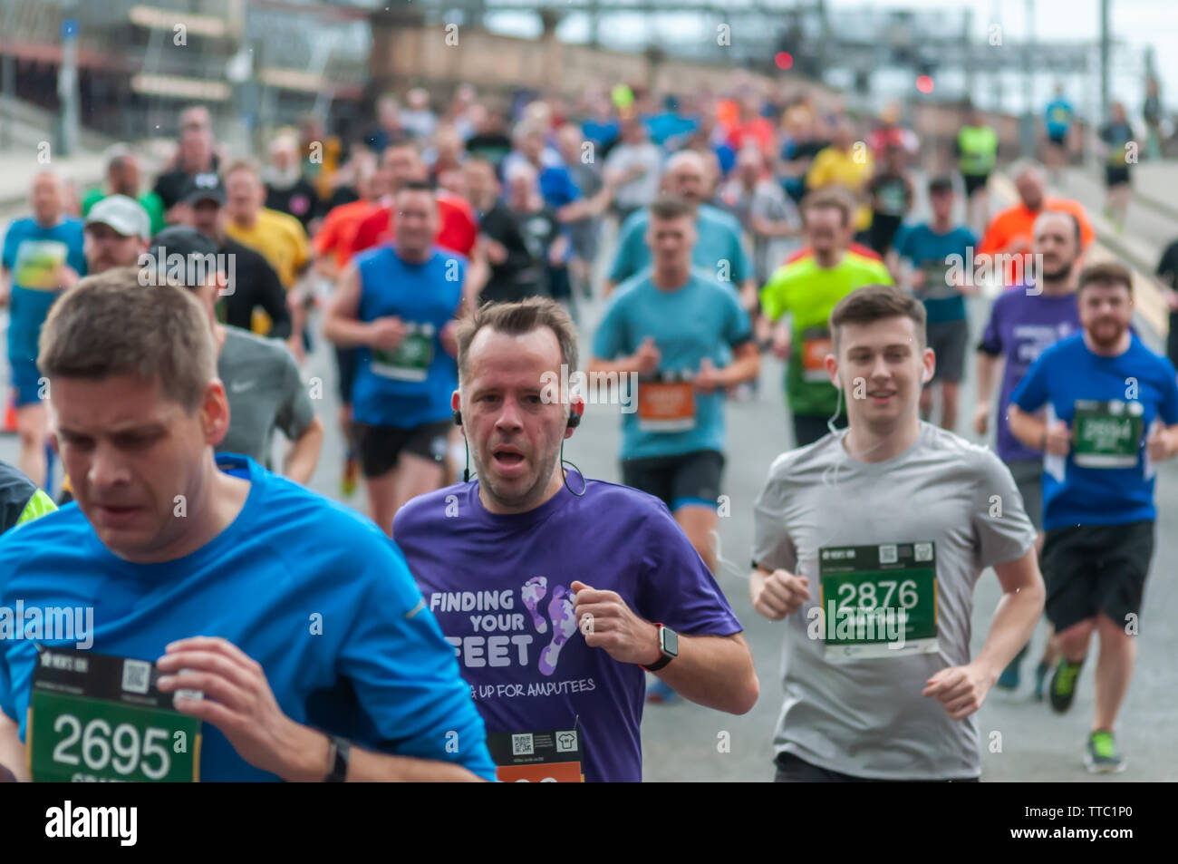 Glasgow, Scotland, UK. 16th June, 2019. Runners crossing the King ...