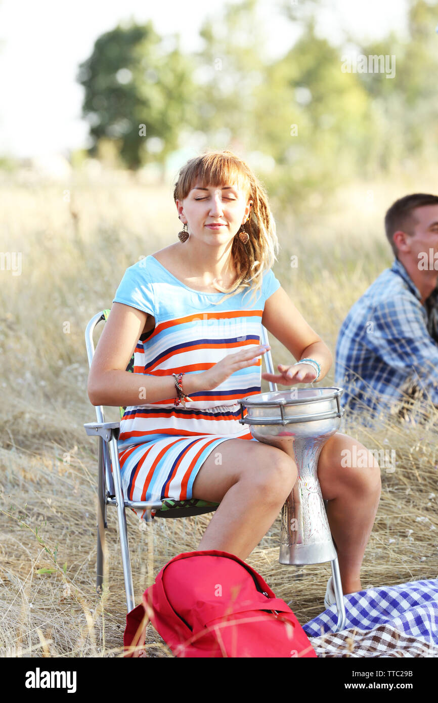Young hippie people relaxing in the forest outdoors Stock Photo - Alamy