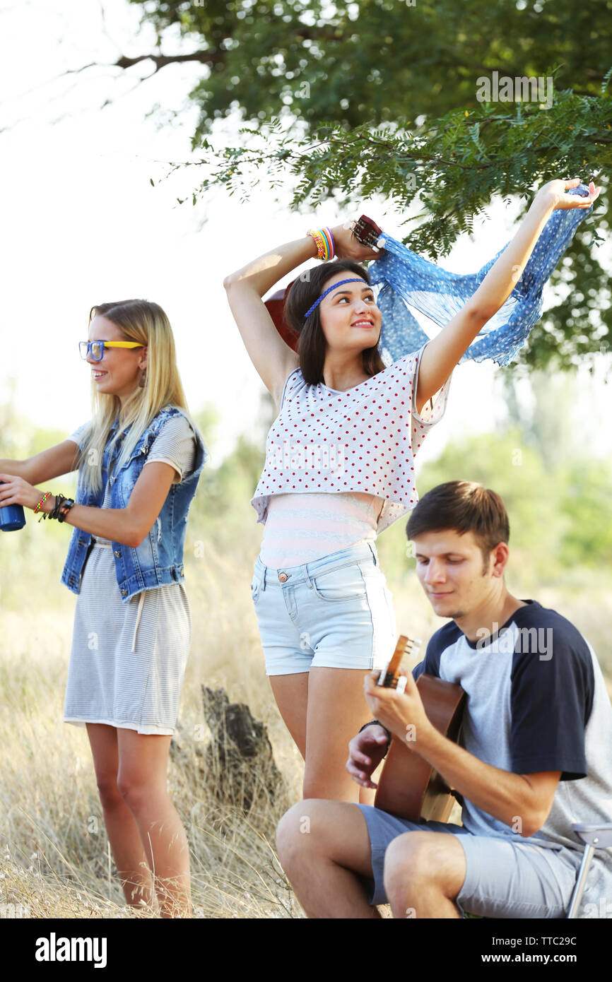 Young hippie people relaxing in the forest outdoors Stock Photo - Alamy