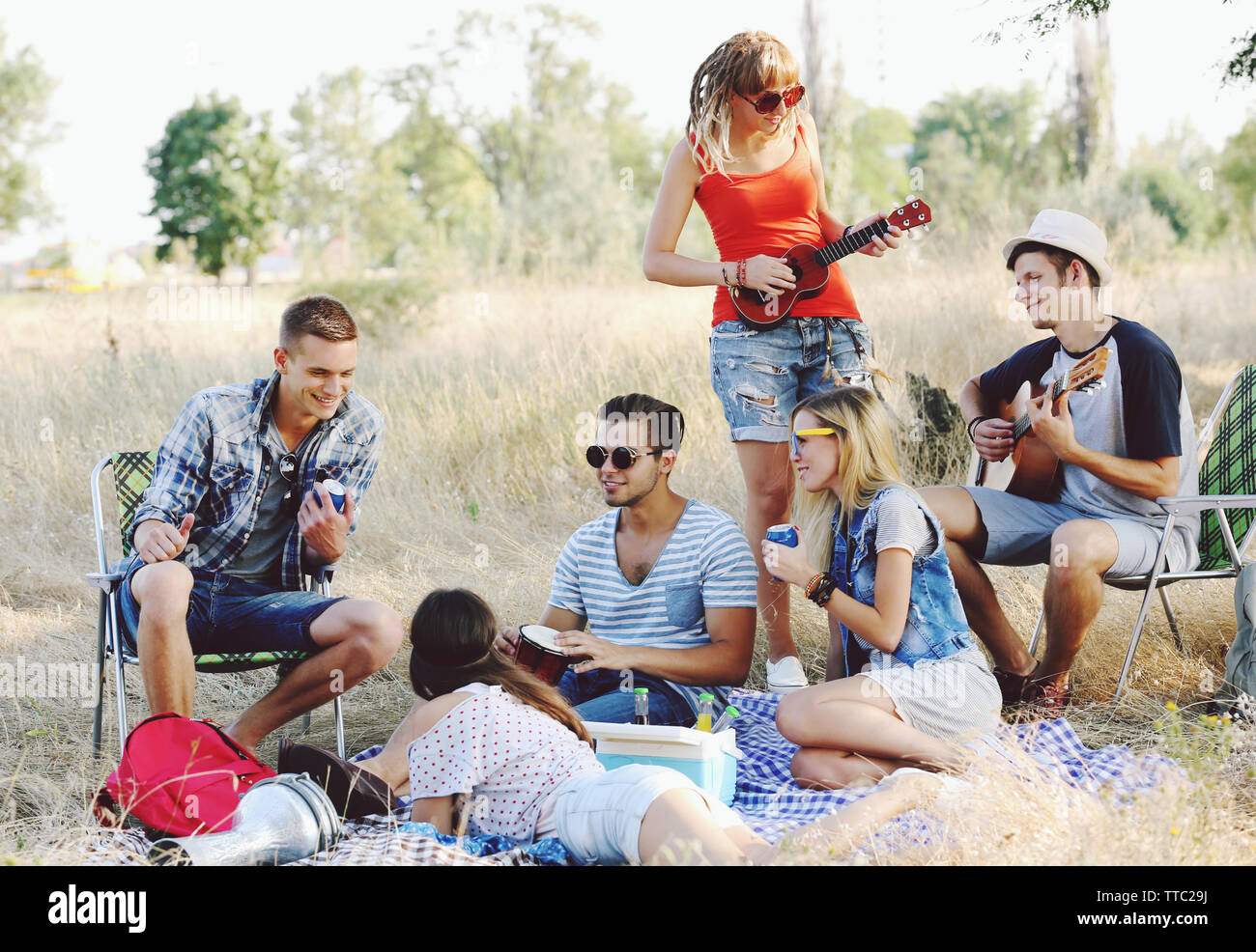 Young hippie people relaxing in the forest outdoors Stock Photo - Alamy