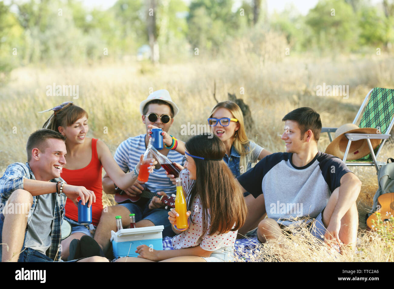 Young hippie people relaxing in the forest outdoors Stock Photo - Alamy