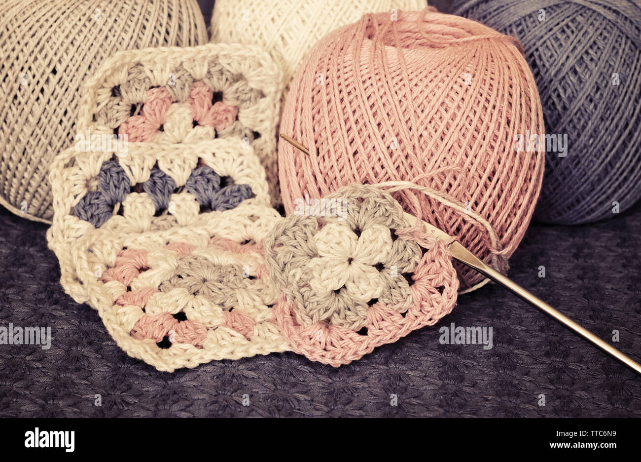 Crochet motives, hook, and cotton yarn on a blue background Stock Photo ...