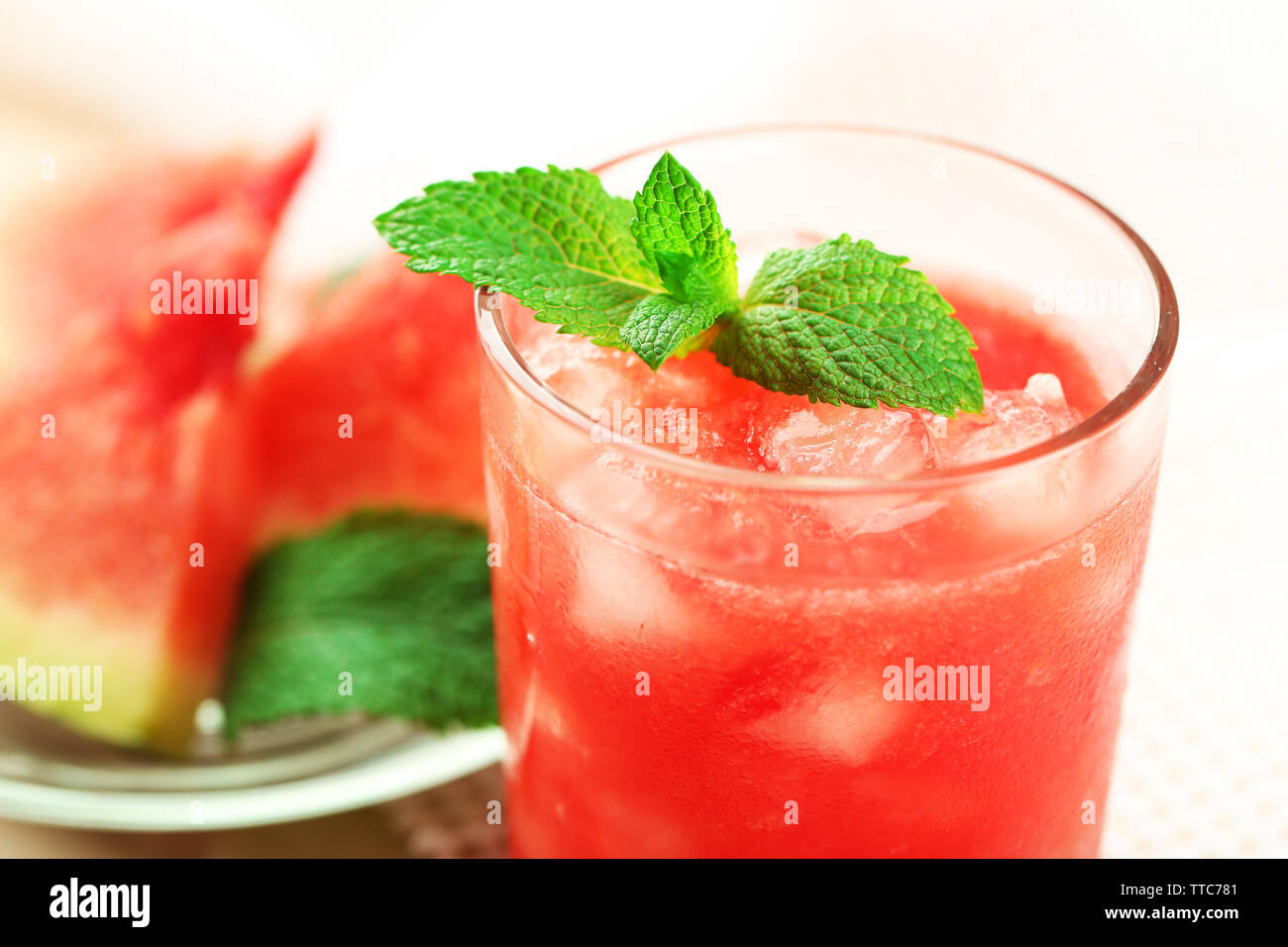 Cold watermelon desserts and drinks in glasses, on wooden table ...