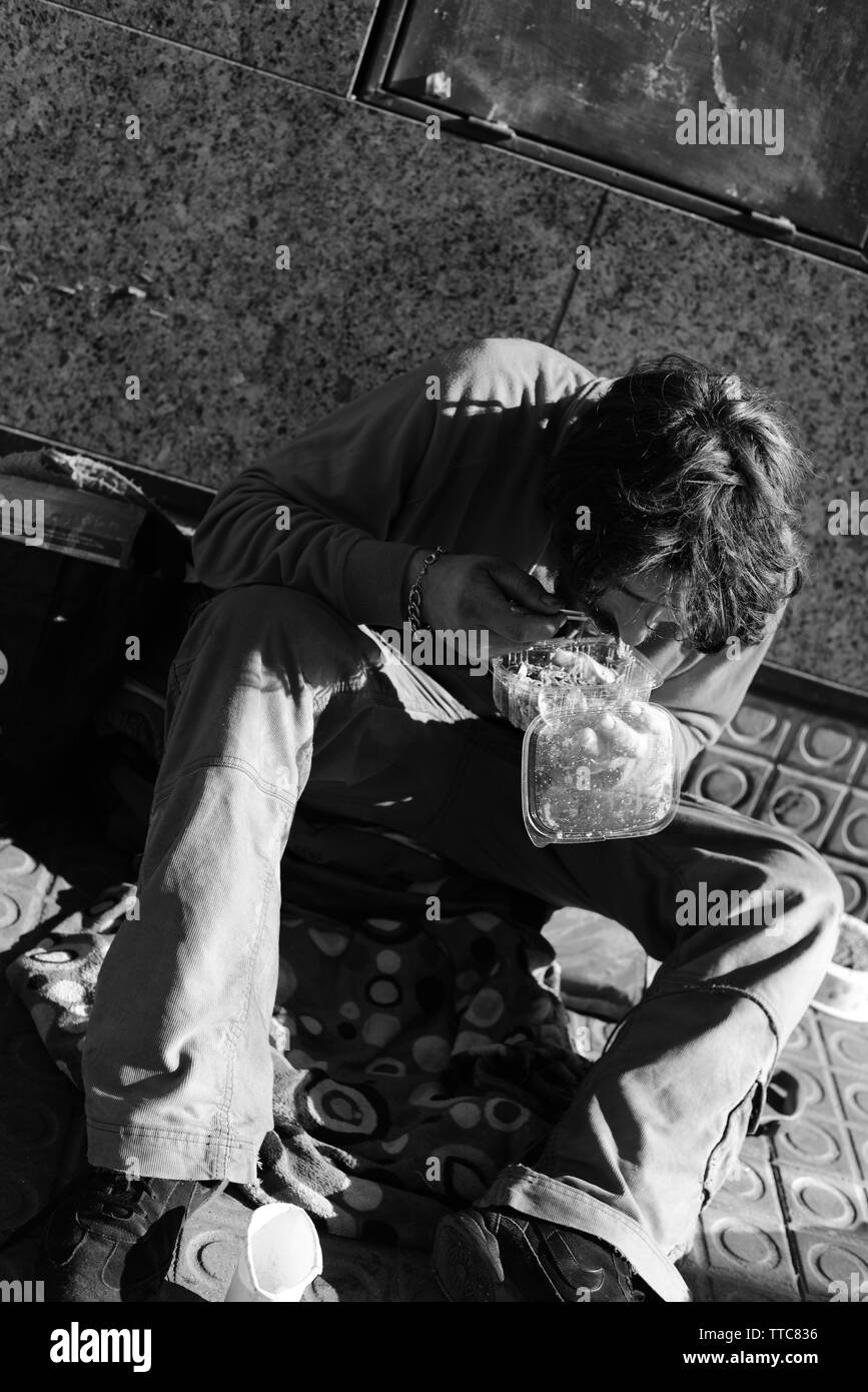Eating on the street Black and White Stock Photos & Images - Alamy