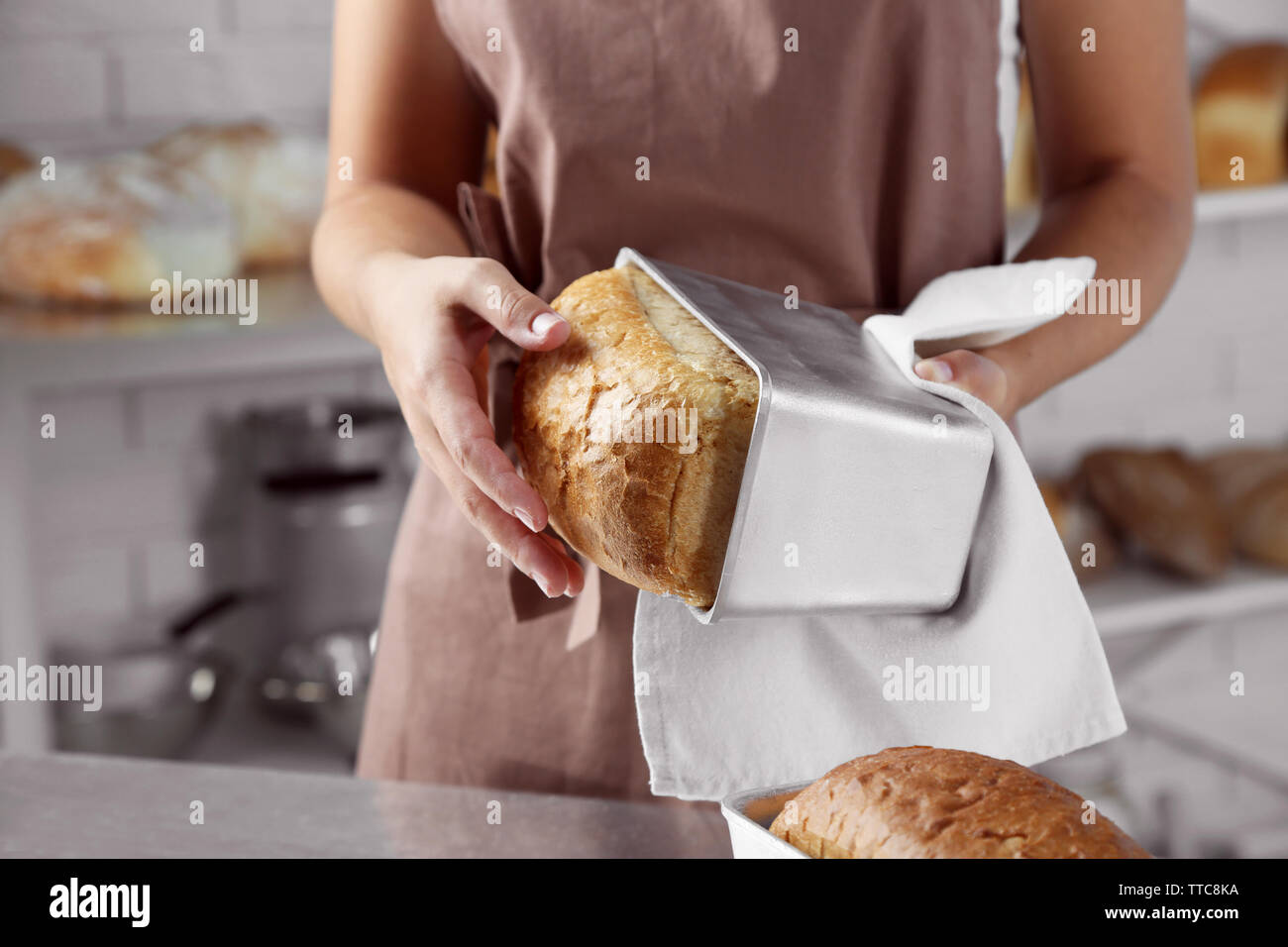 Baker with freshly baked bread in kitchen of bakery Stock Photo - Alamy