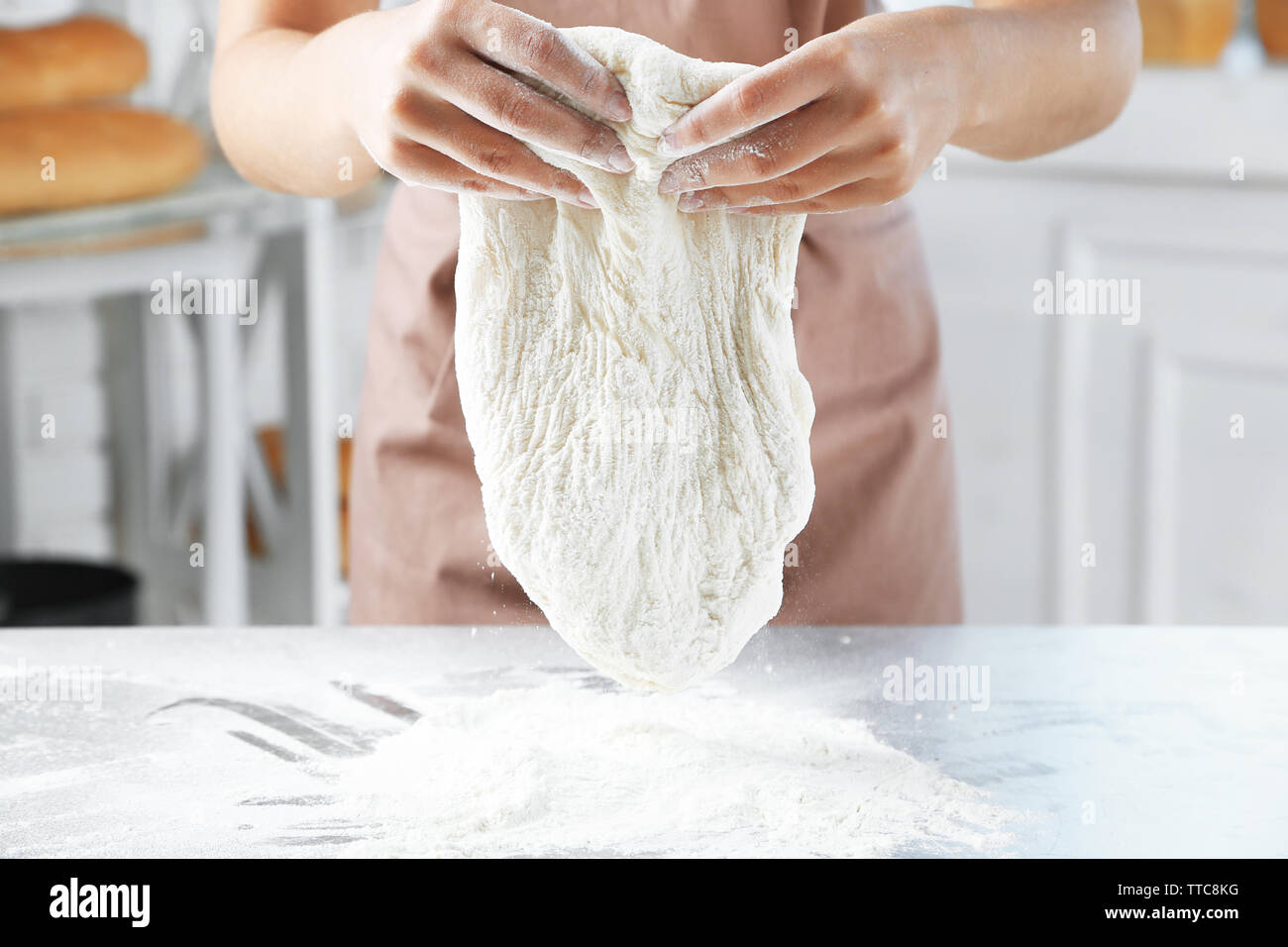 Making dough by female hands at bakery Stock Photo - Alamy