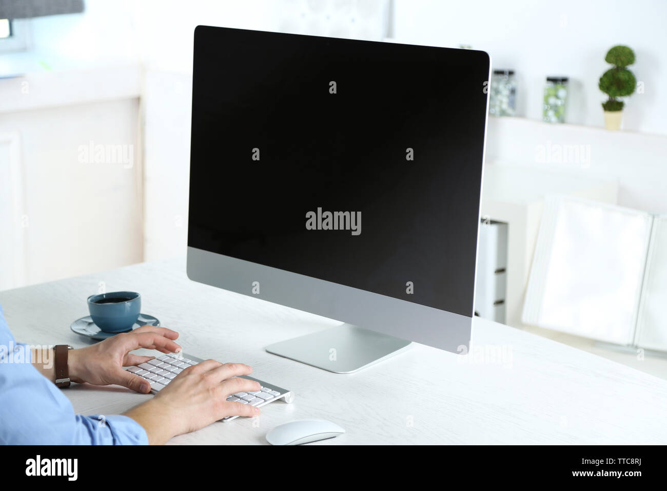 Man working with computer in office Stock Photo - Alamy