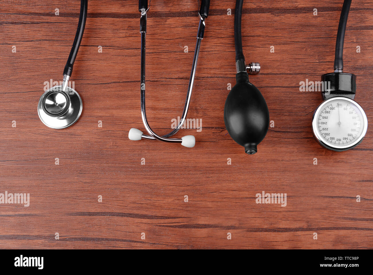 Blood pressure meter and stethoscope, on wooden background Stock Photo ...