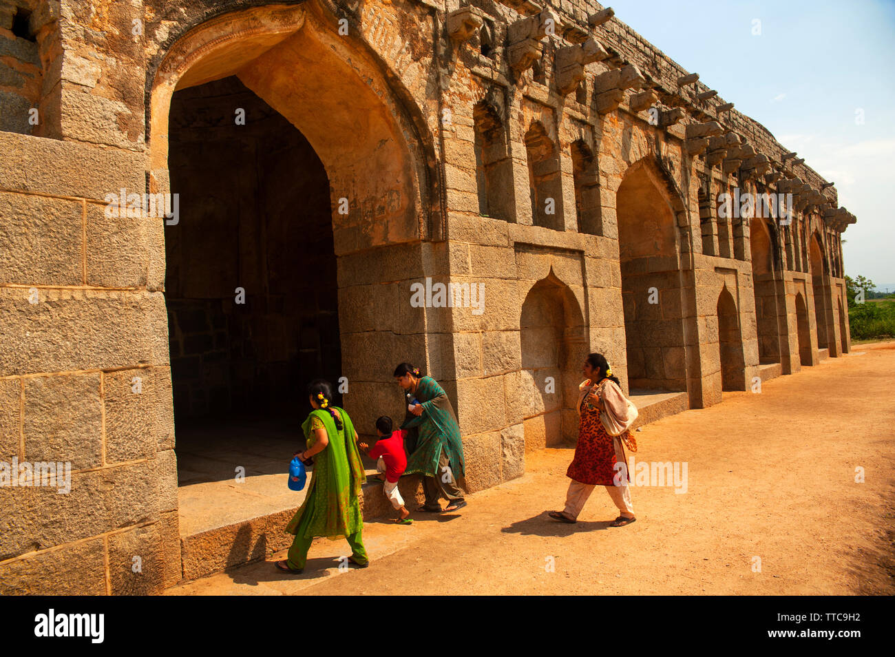 Indian people visiting the Elephant Stables at Hampi, Karnataka, India ...
