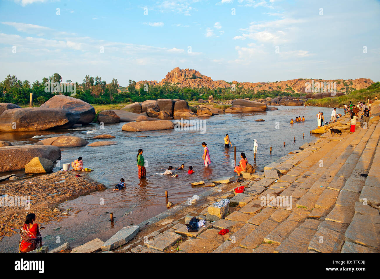 Indian people bathing at Tungabhadra River, Hampi, Karnataka, India ...