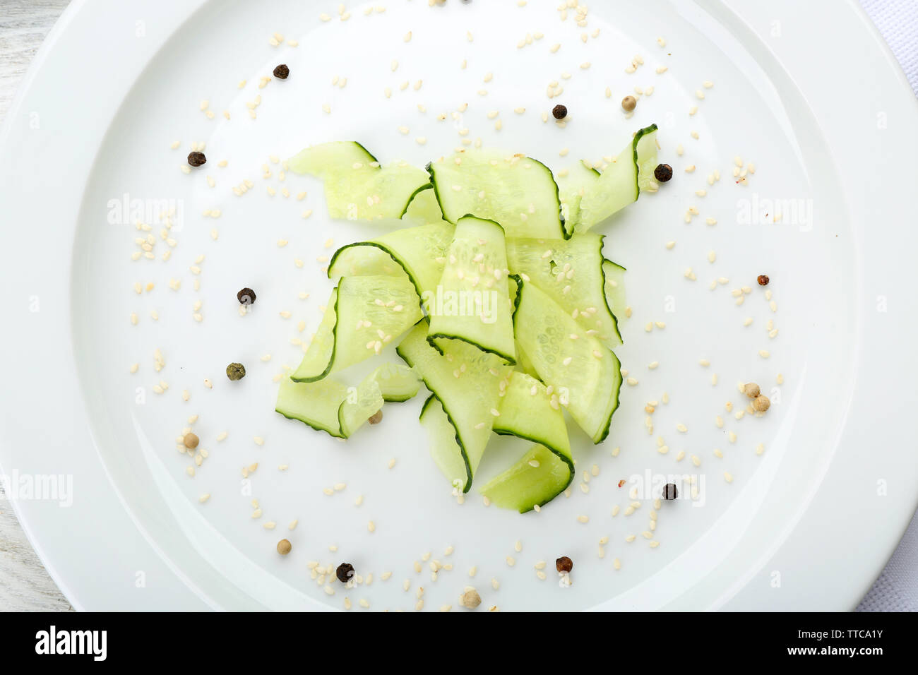 Sliced cucumbers dish on white plate in the restaurant, close up Stock ...