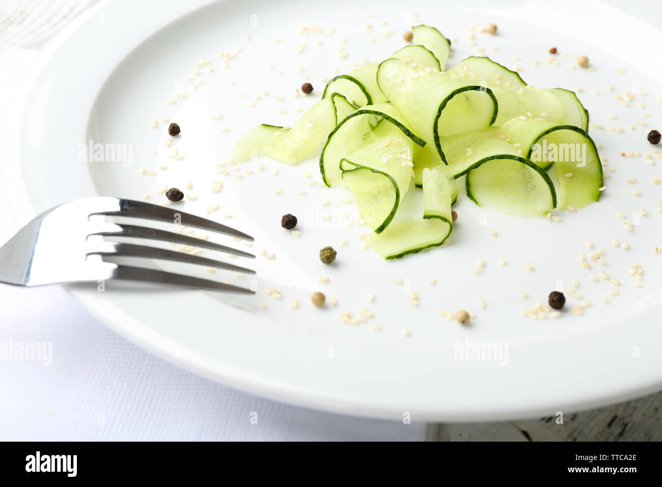 Sliced cucumbers dish on white plate in the restaurant, close up Stock ...
