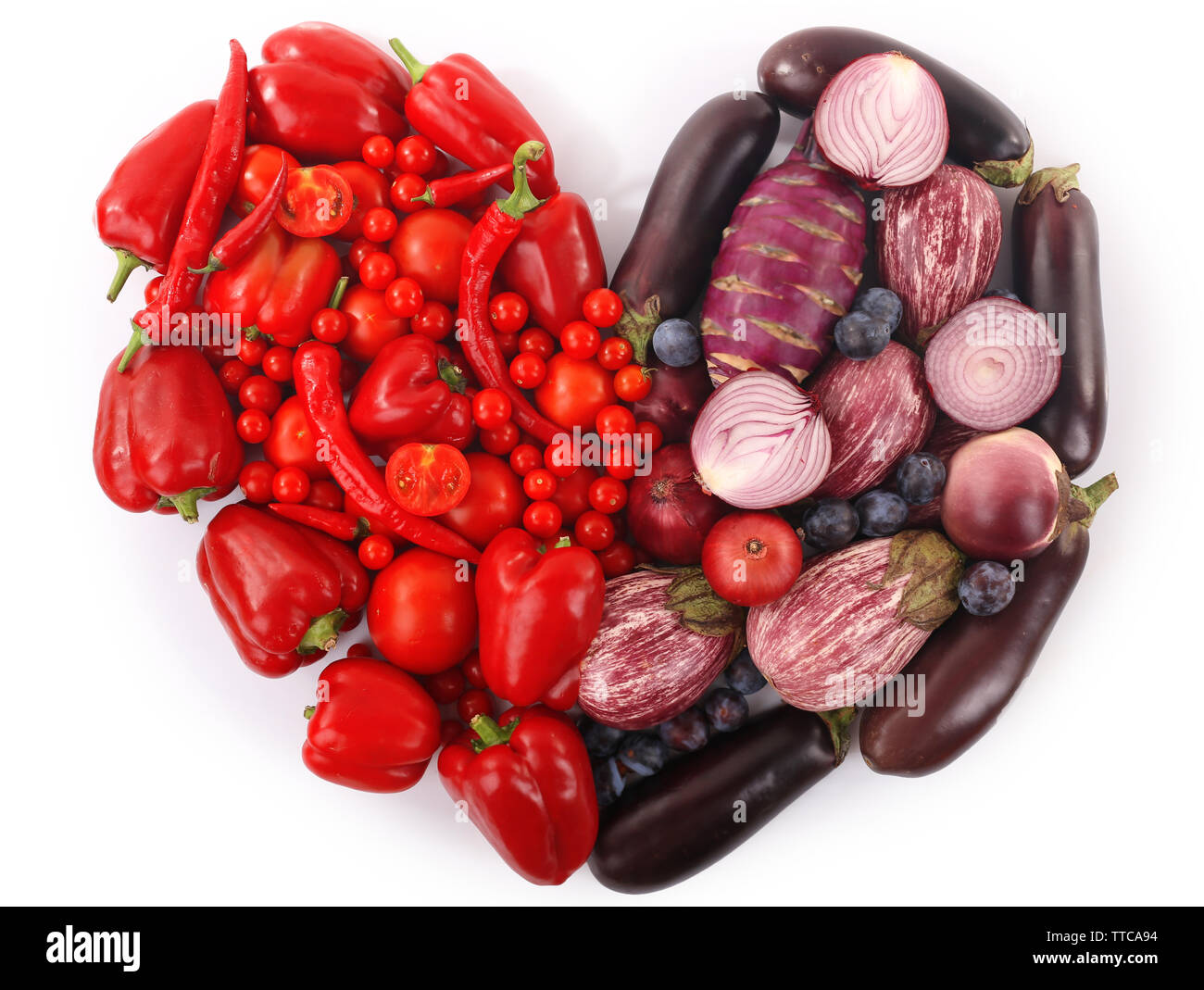 Heart-shaped composition of various raw organic vegetables isolated on ...