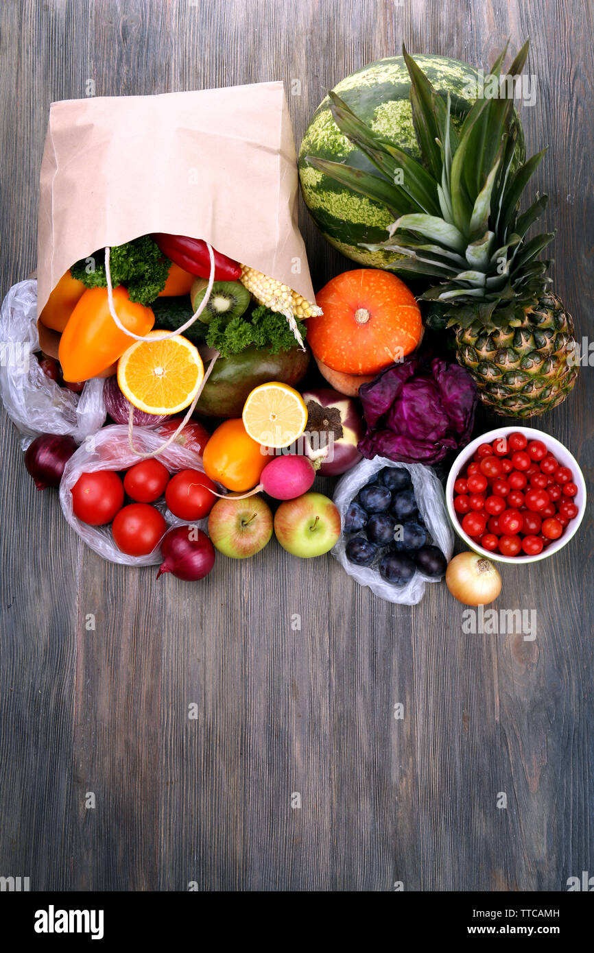 Fruits and vegetables on wooden table background Stock Photo - Alamy