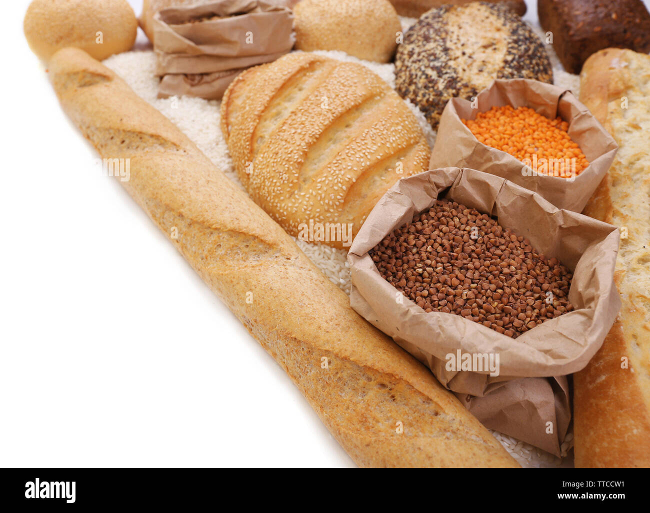 Composition of mixed breads and grains on white background Stock Photo ...