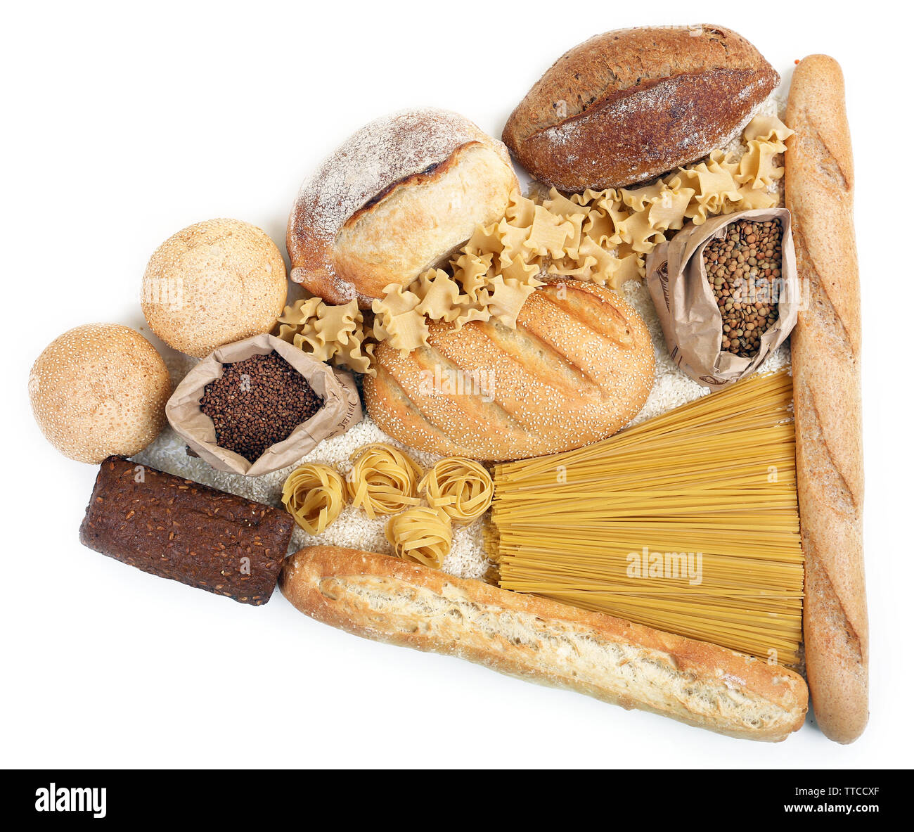 Composition of mixed breads, macaroni and grains on white background ...