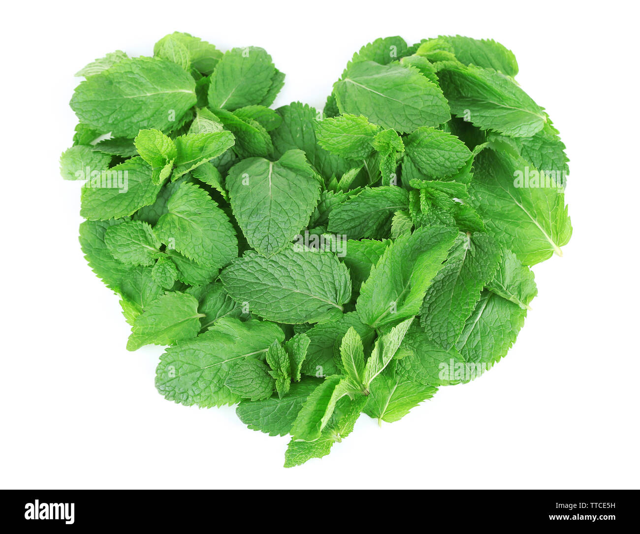 Heart shaped pile of mint isolated on white Stock Photo - Alamy