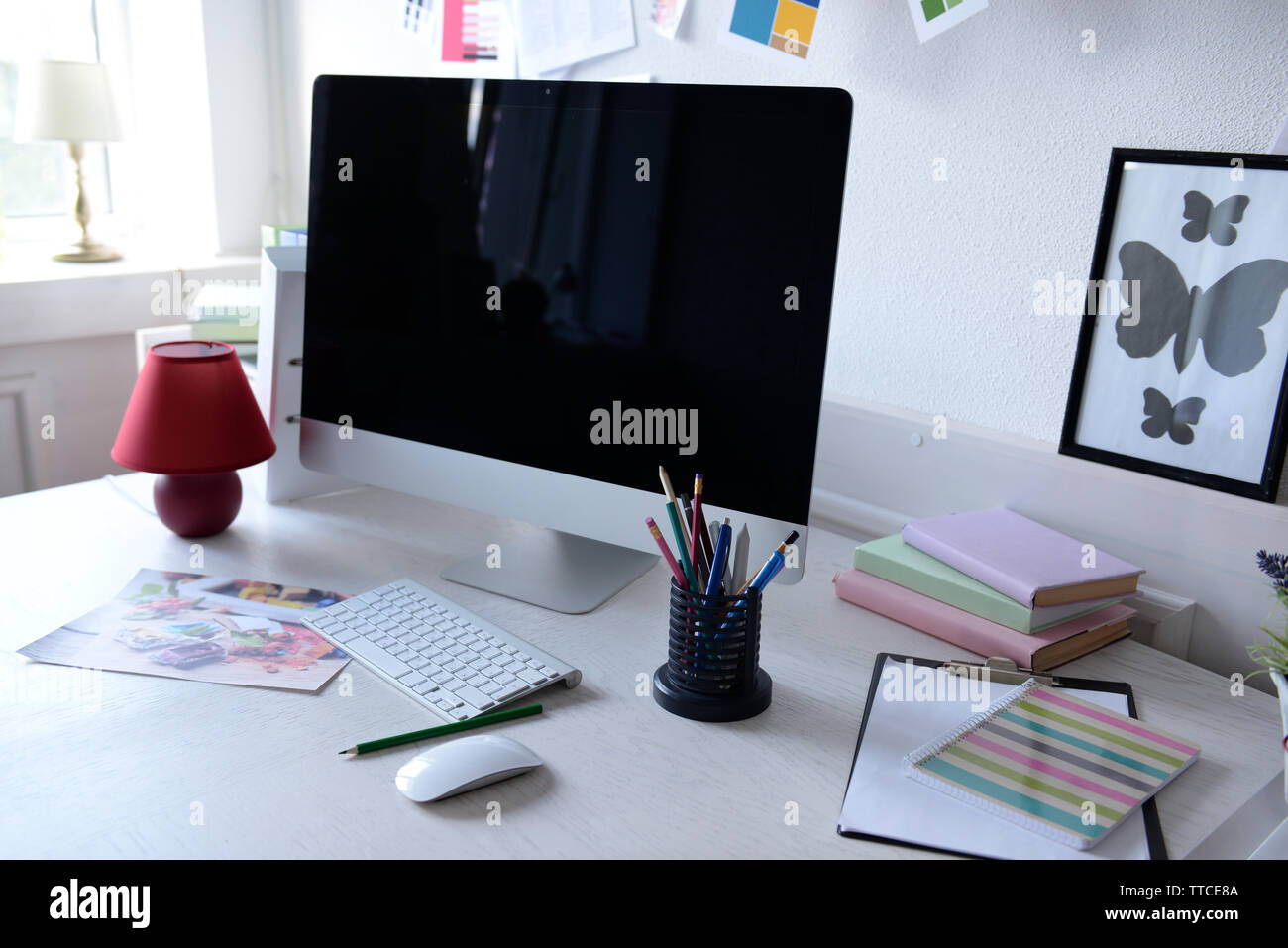Modern computer on the table in decorated room Stock Photo - Alamy