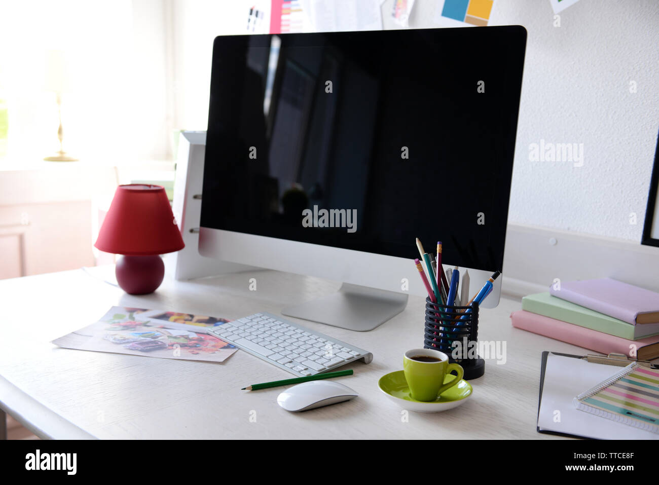 Modern computer on the table in decorated room Stock Photo - Alamy