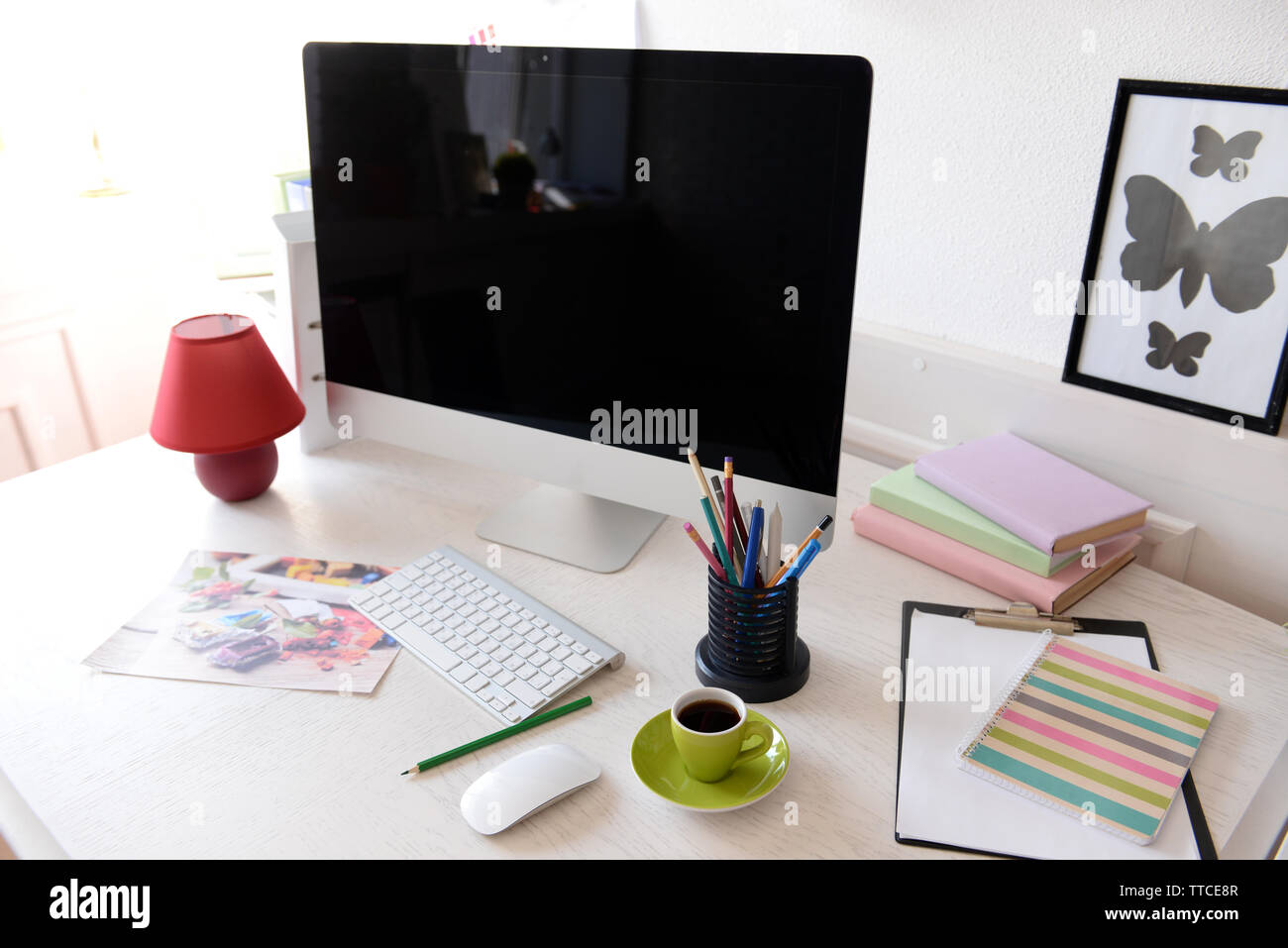 Modern computer on the table in decorated room Stock Photo - Alamy