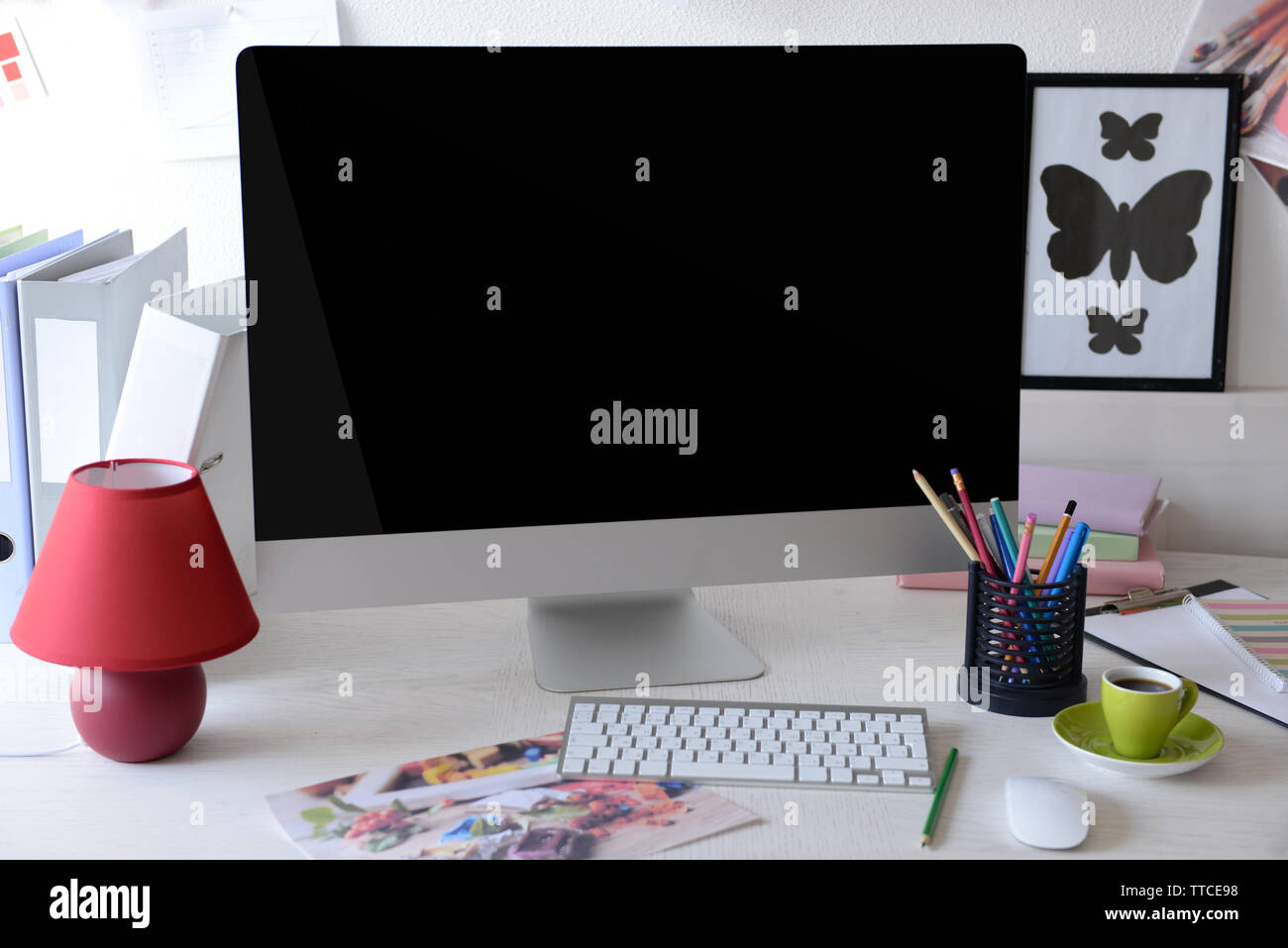 Modern computer on the table in decorated room Stock Photo - Alamy
