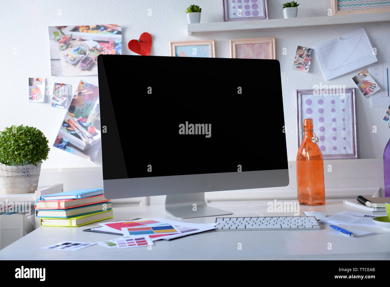 Modern workplace with computer on the table in decorated room Stock ...