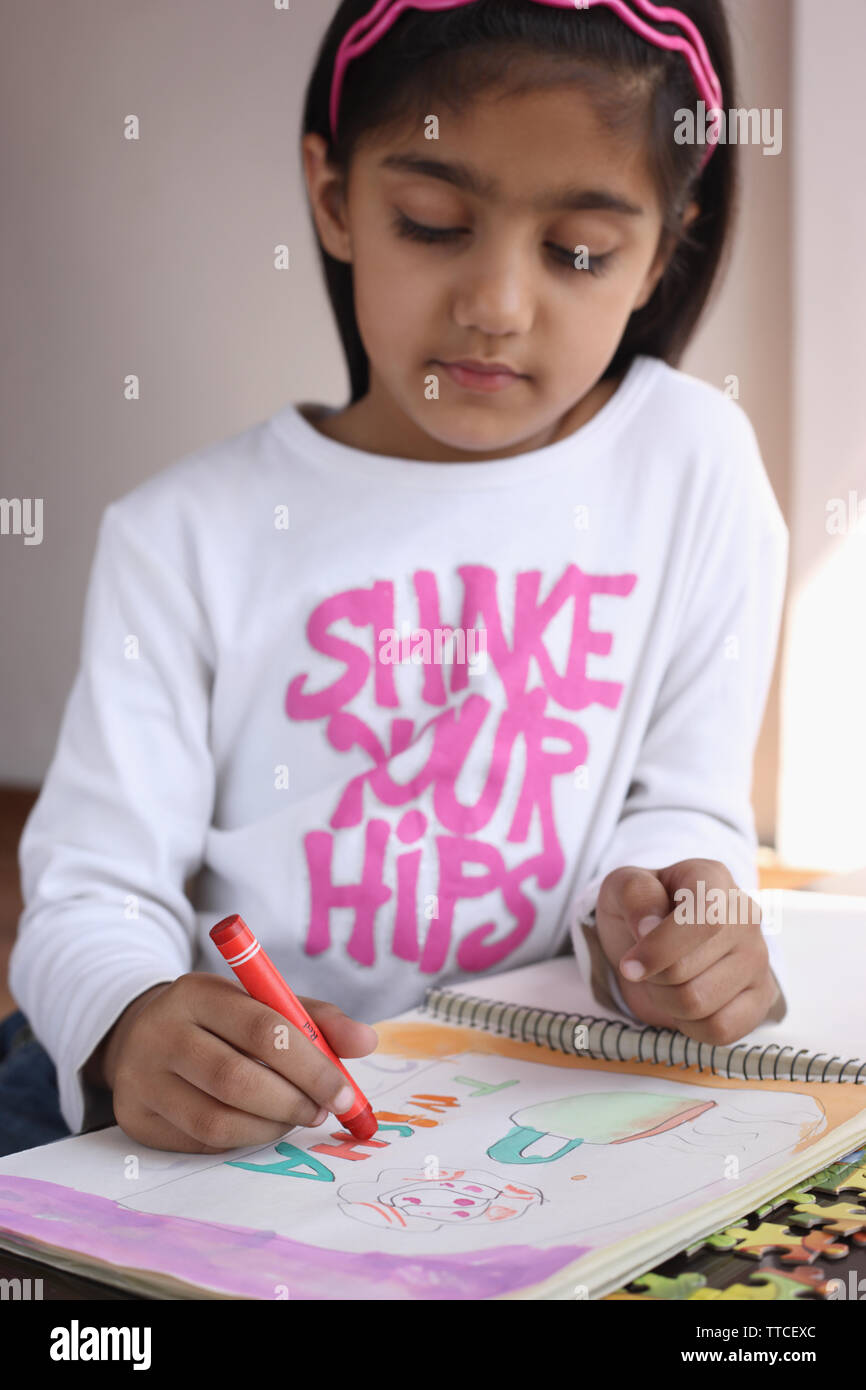 Girl drawing in a sketch book Stock Photo - Alamy
