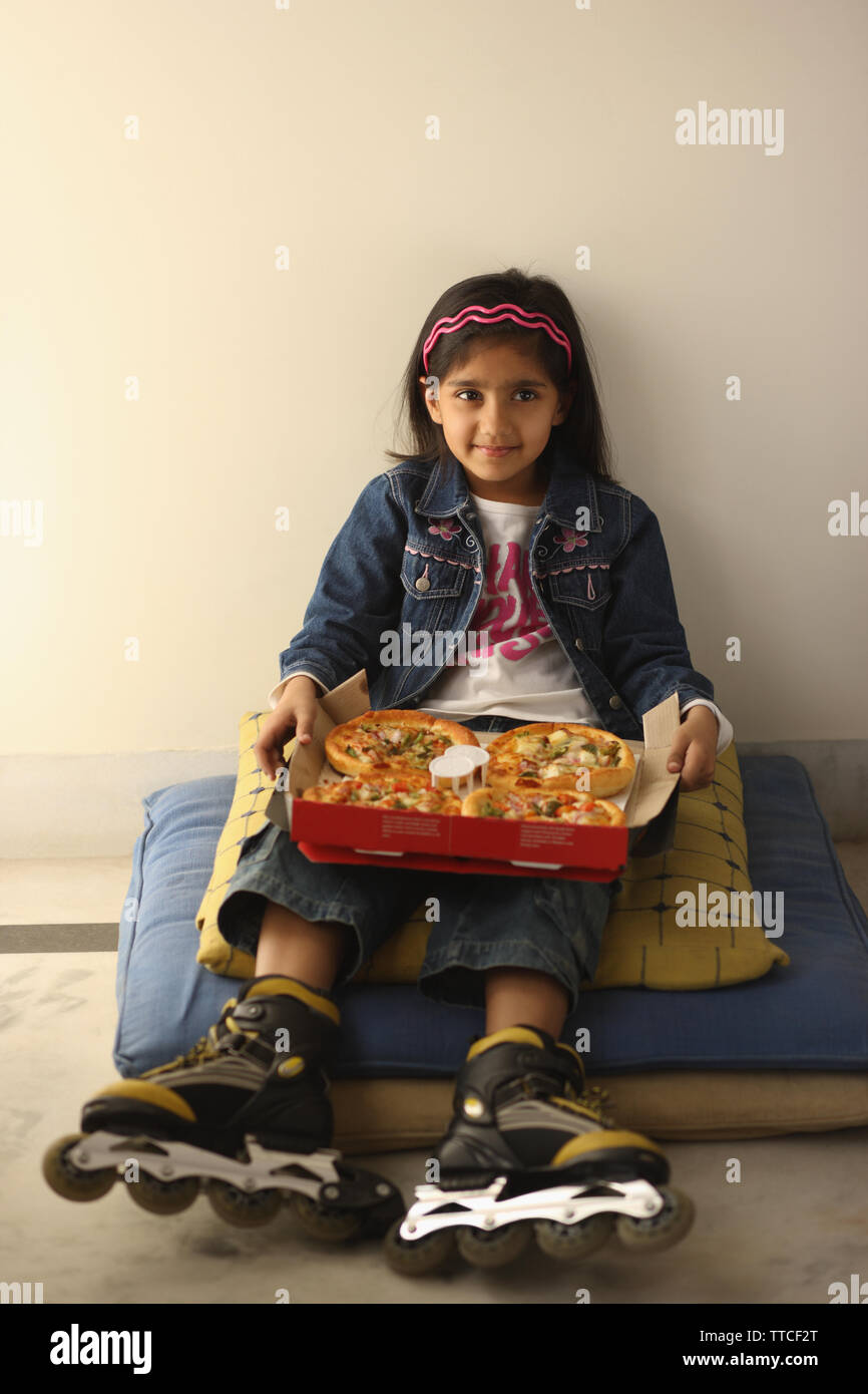 Girl holding a pizza box Stock Photo - Alamy