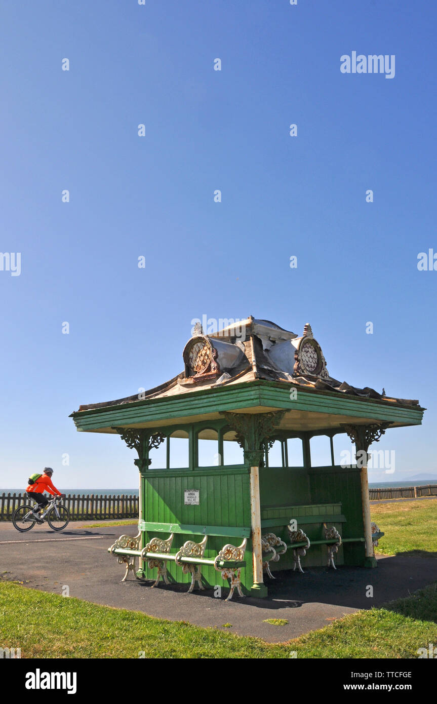 Victorian Blackpool beach shelter and cyclist on promenade, north shore ...