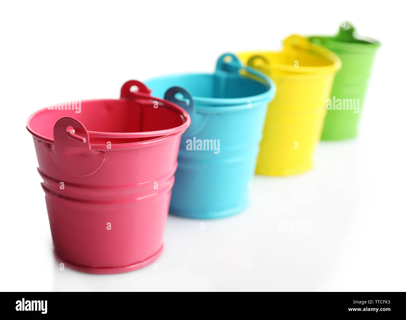 Four buckets of different colours, isolated on white Stock Photo - Alamy