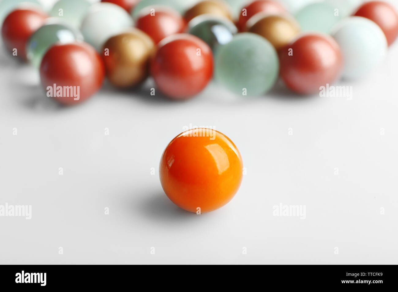 Orange ball opposite others, isolated on white, individuality concept ...