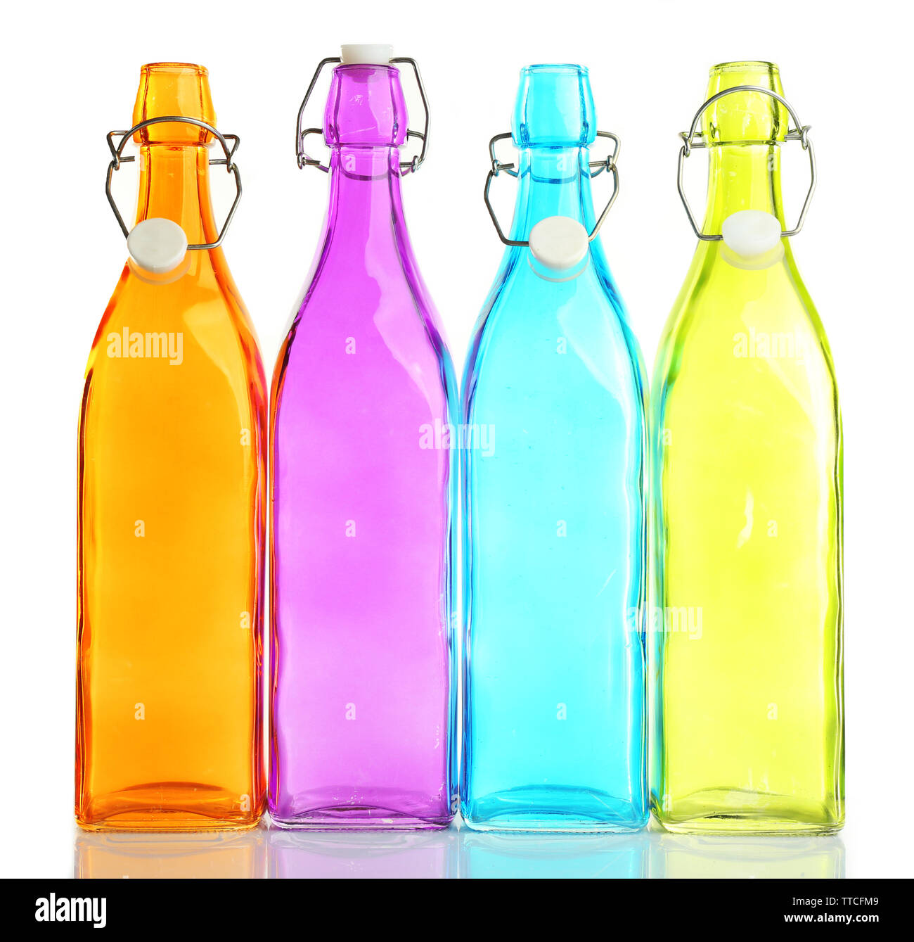 Four empty colourful bottles, isolated on white Stock Photo - Alamy
