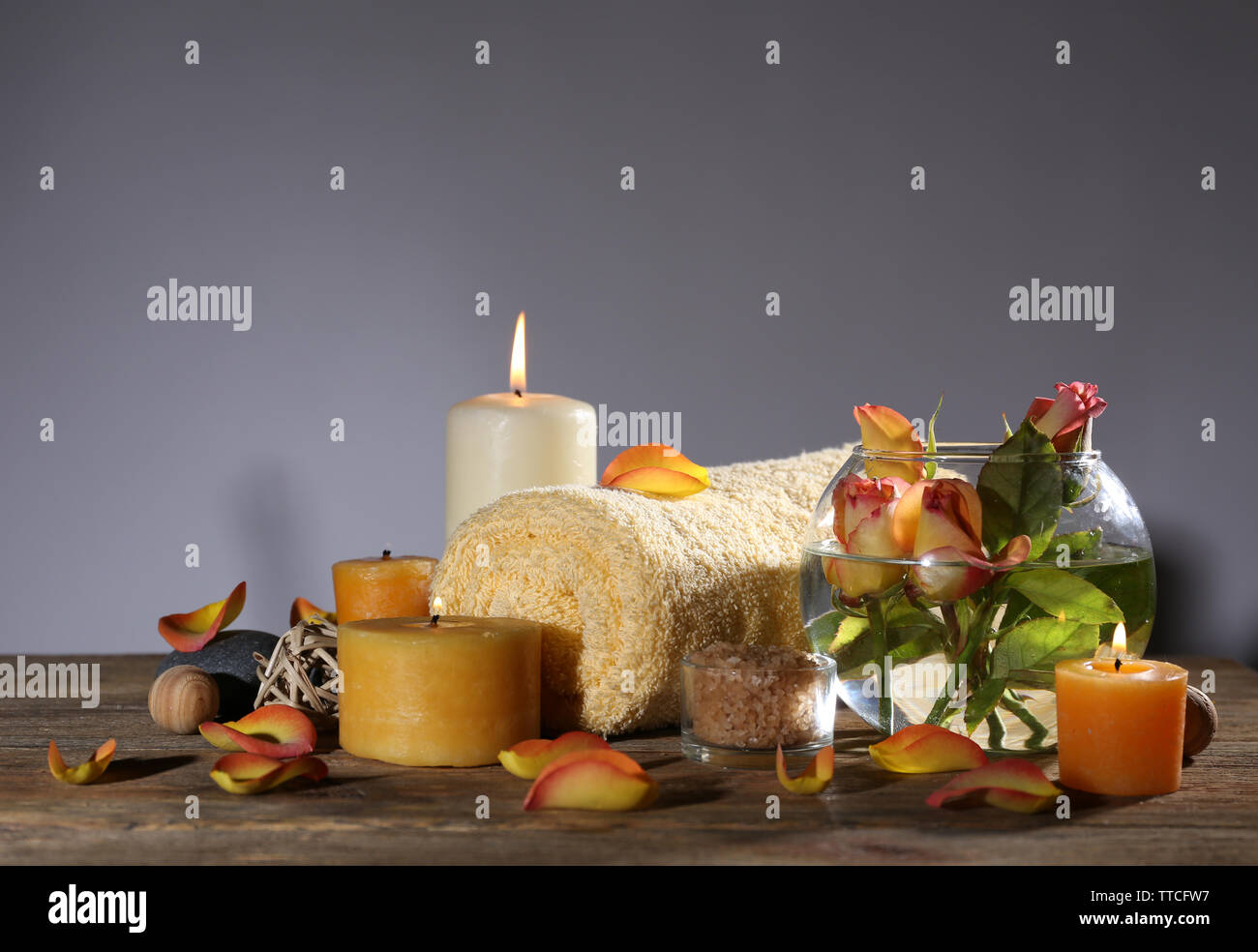 Beautiful spa composition with alight candles on wooden table Stock ...