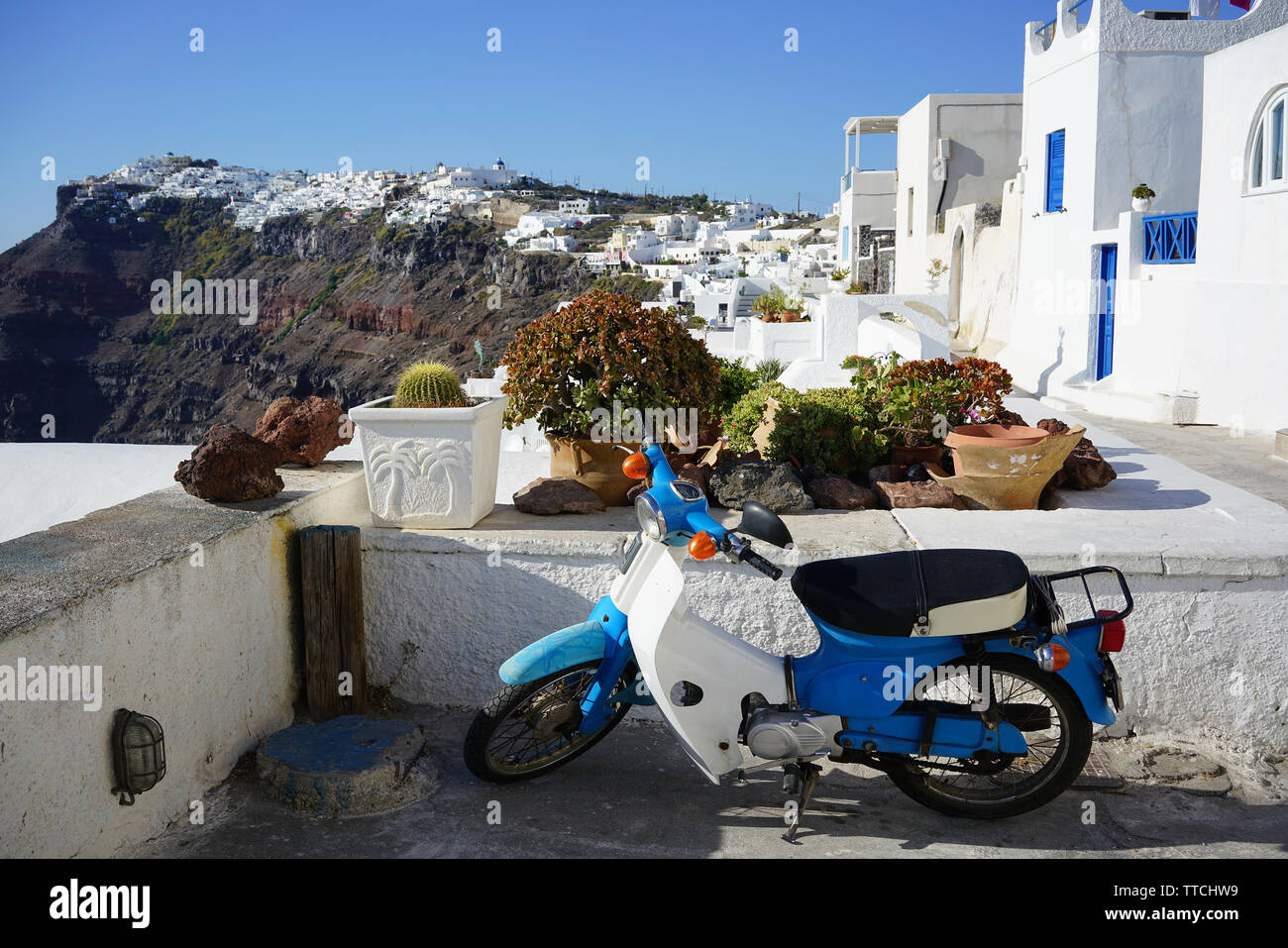 Traditional cubical houses and motorbike of Santorini Island, Greece ...