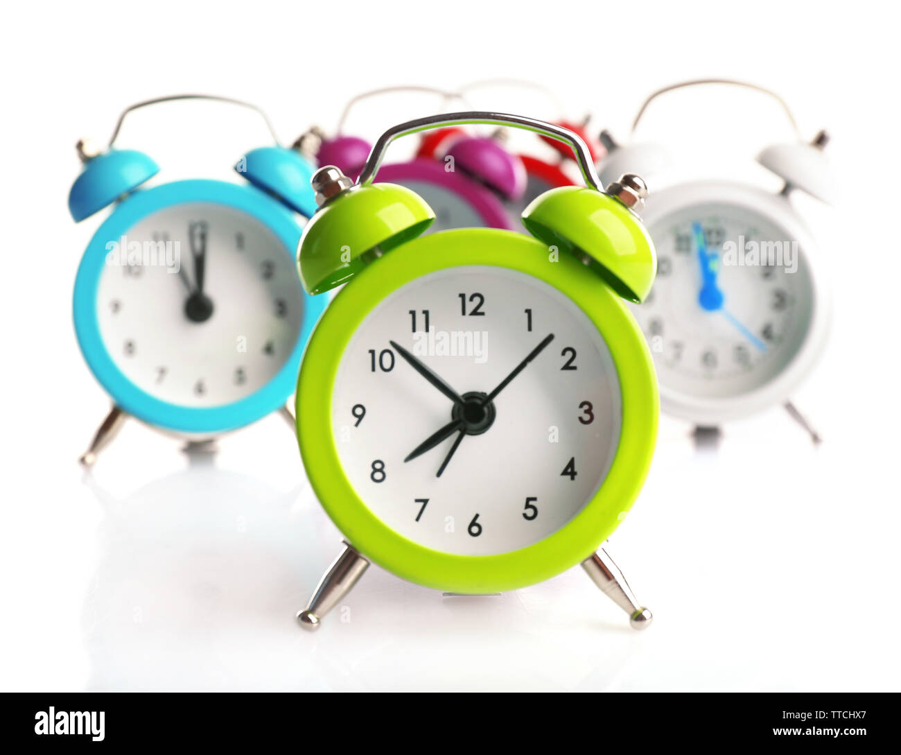 A group of alarm clocks, isolated on white Stock Photo - Alamy