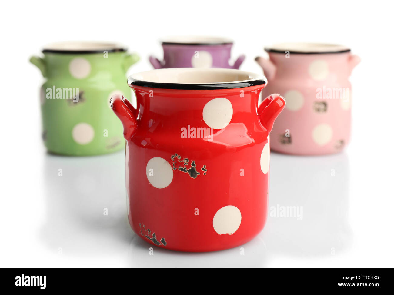 Old colourful milk cans with polka dots, isolated on white Stock Photo ...