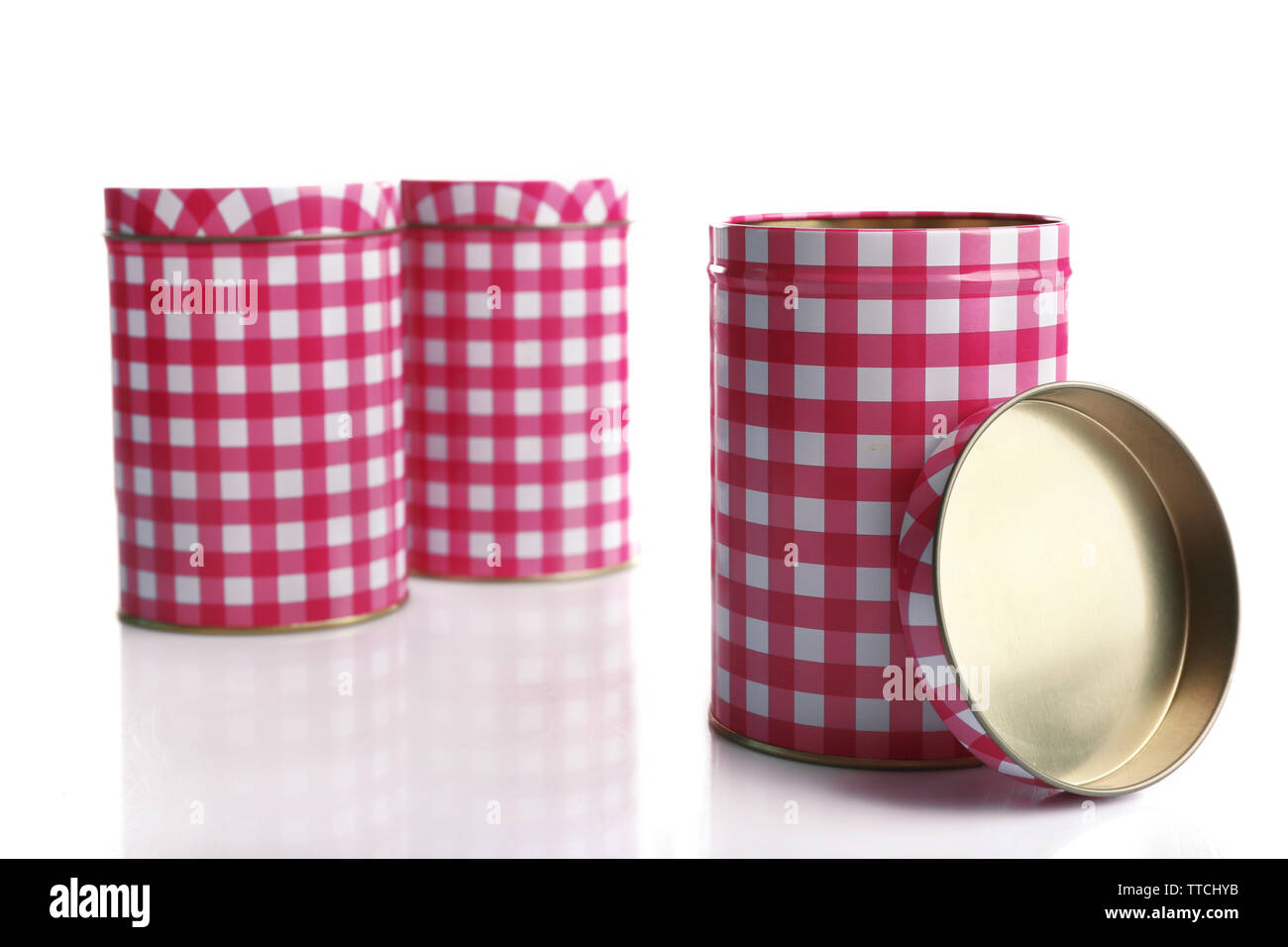Three red and white checkered tin containers, isolated on white Stock ...