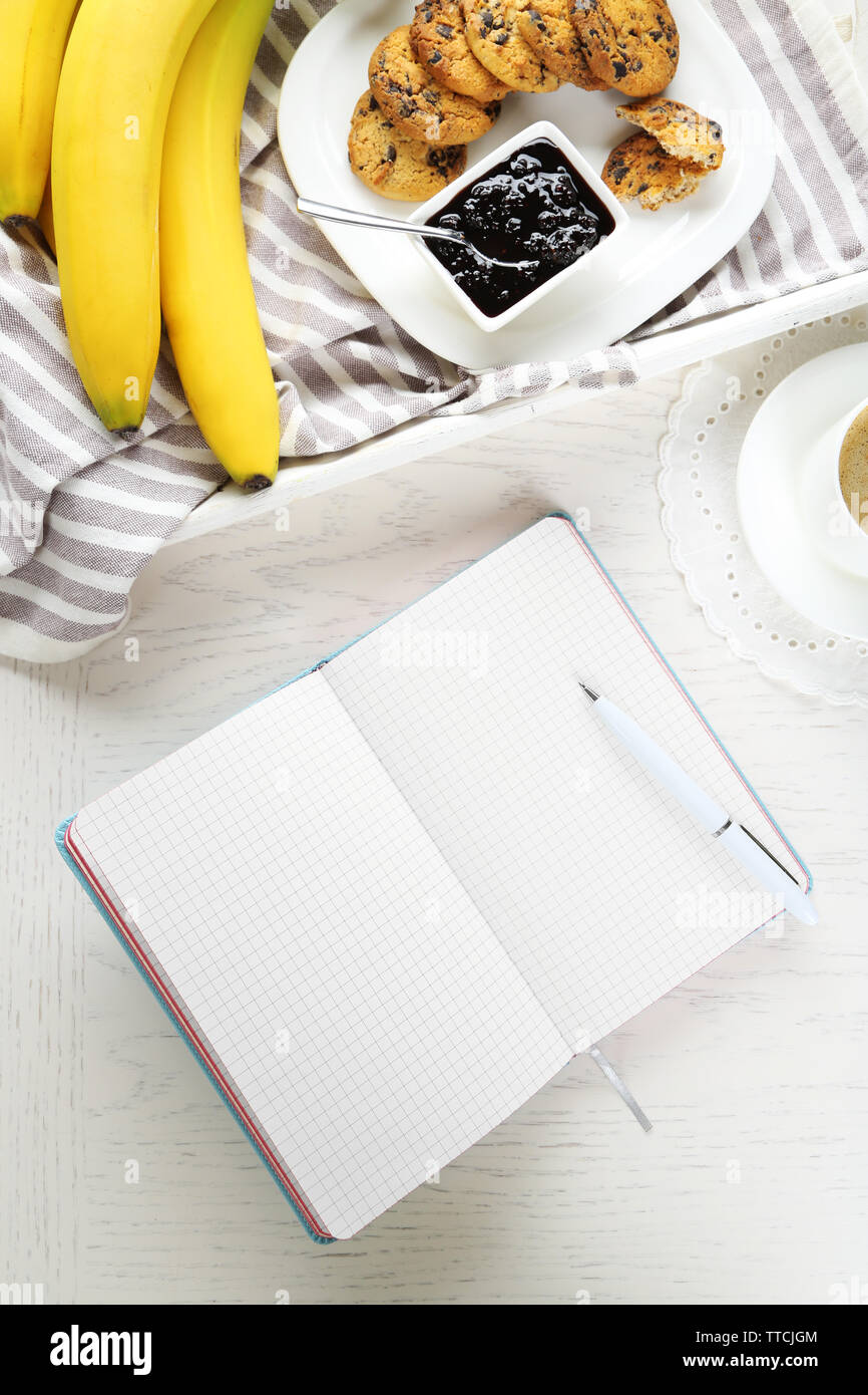Healthy breakfast and opened notebook on white table Stock Photo - Alamy