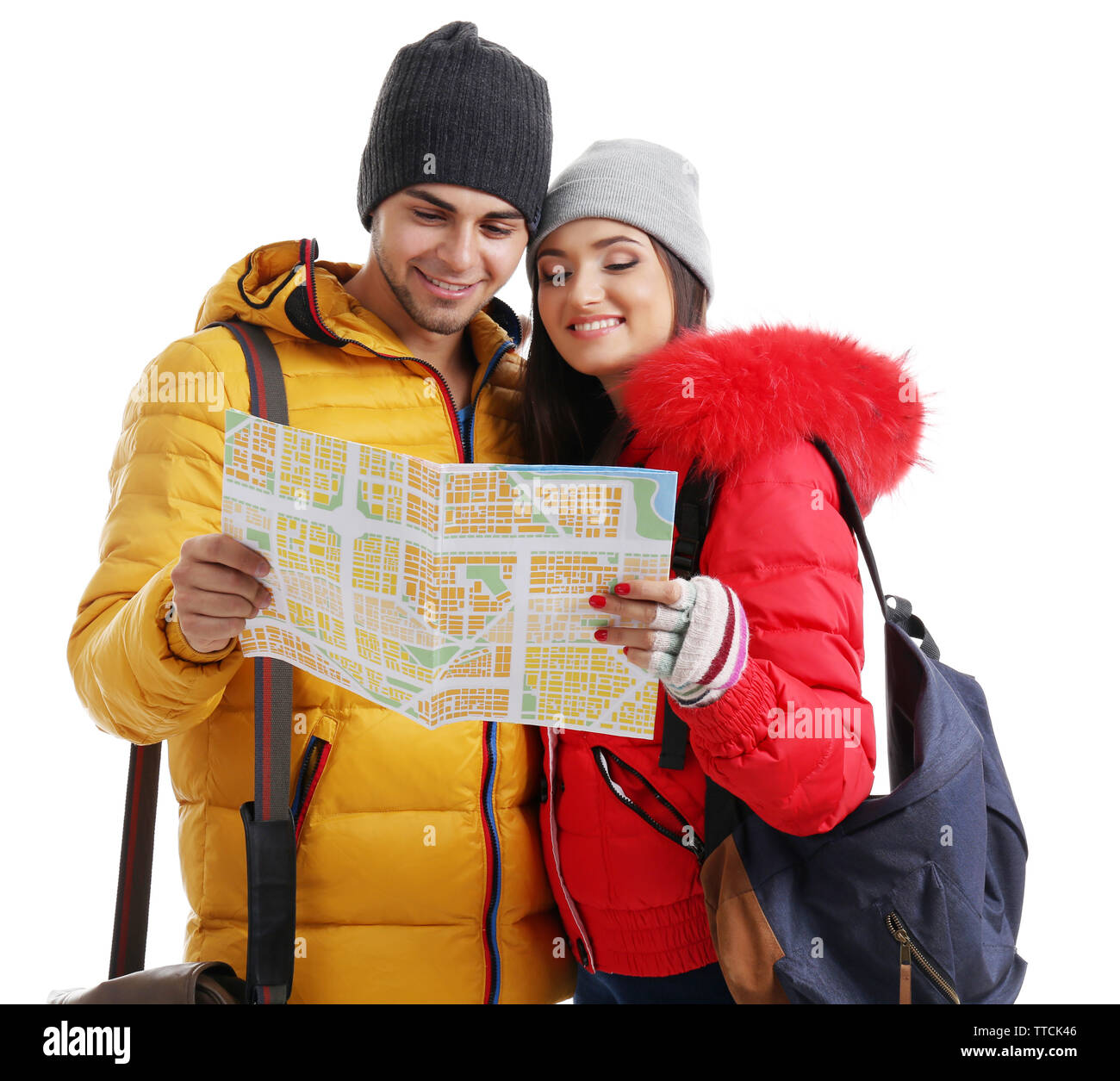 A pair of happy tourists sightseeing in winter, isolated on white Stock ...