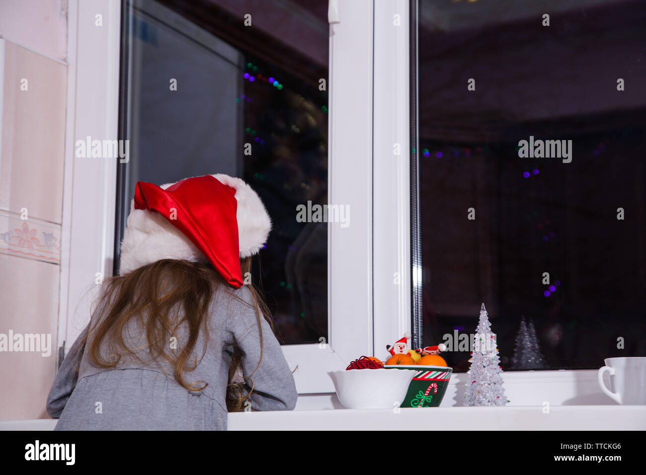 Little girl waiting for Santa Claus. Waiting for magic Christmas and ...