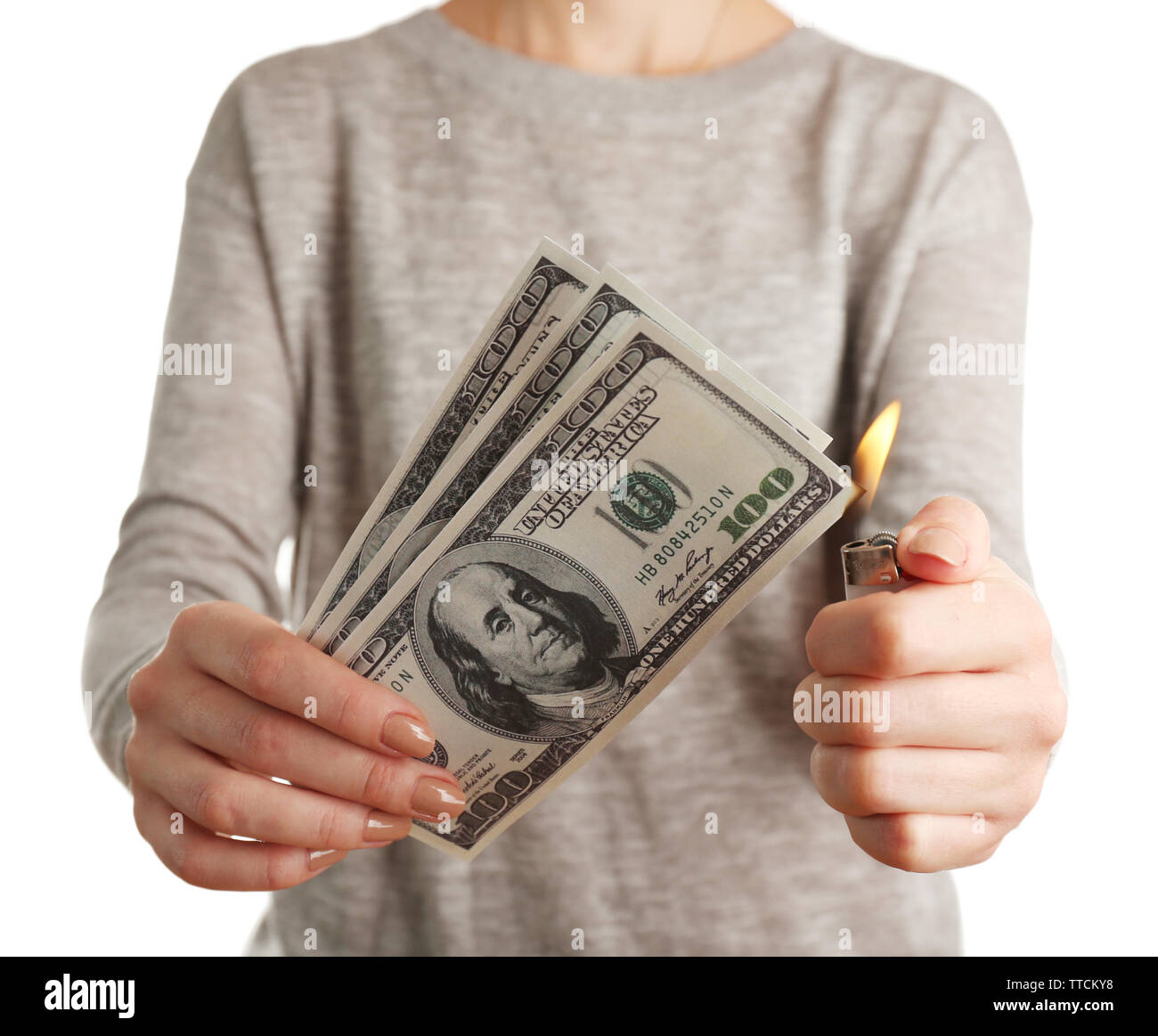 Woman burning dollar banknotes isolated on white Stock Photo - Alamy
