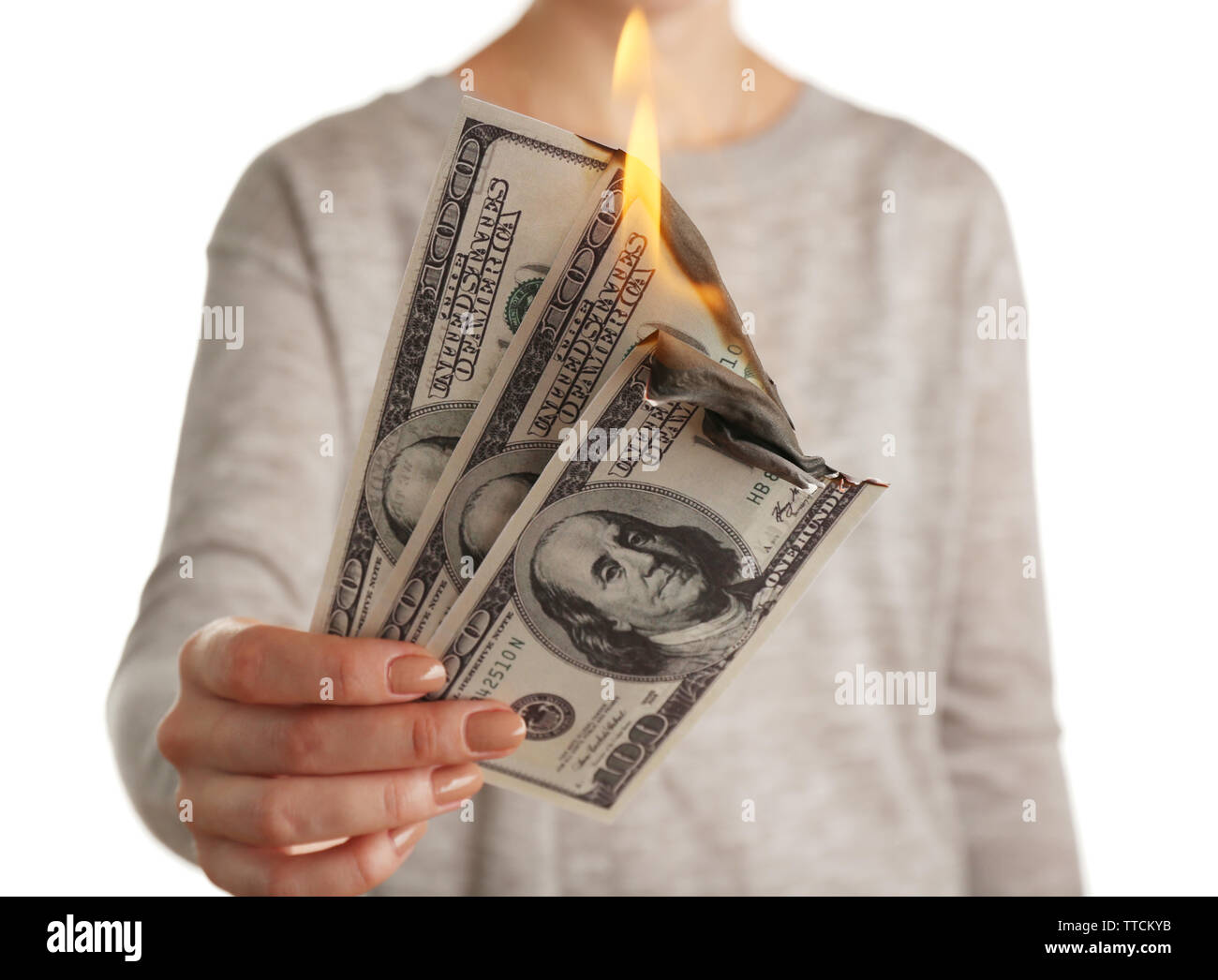 Woman burning dollar banknotes isolated on white Stock Photo - Alamy